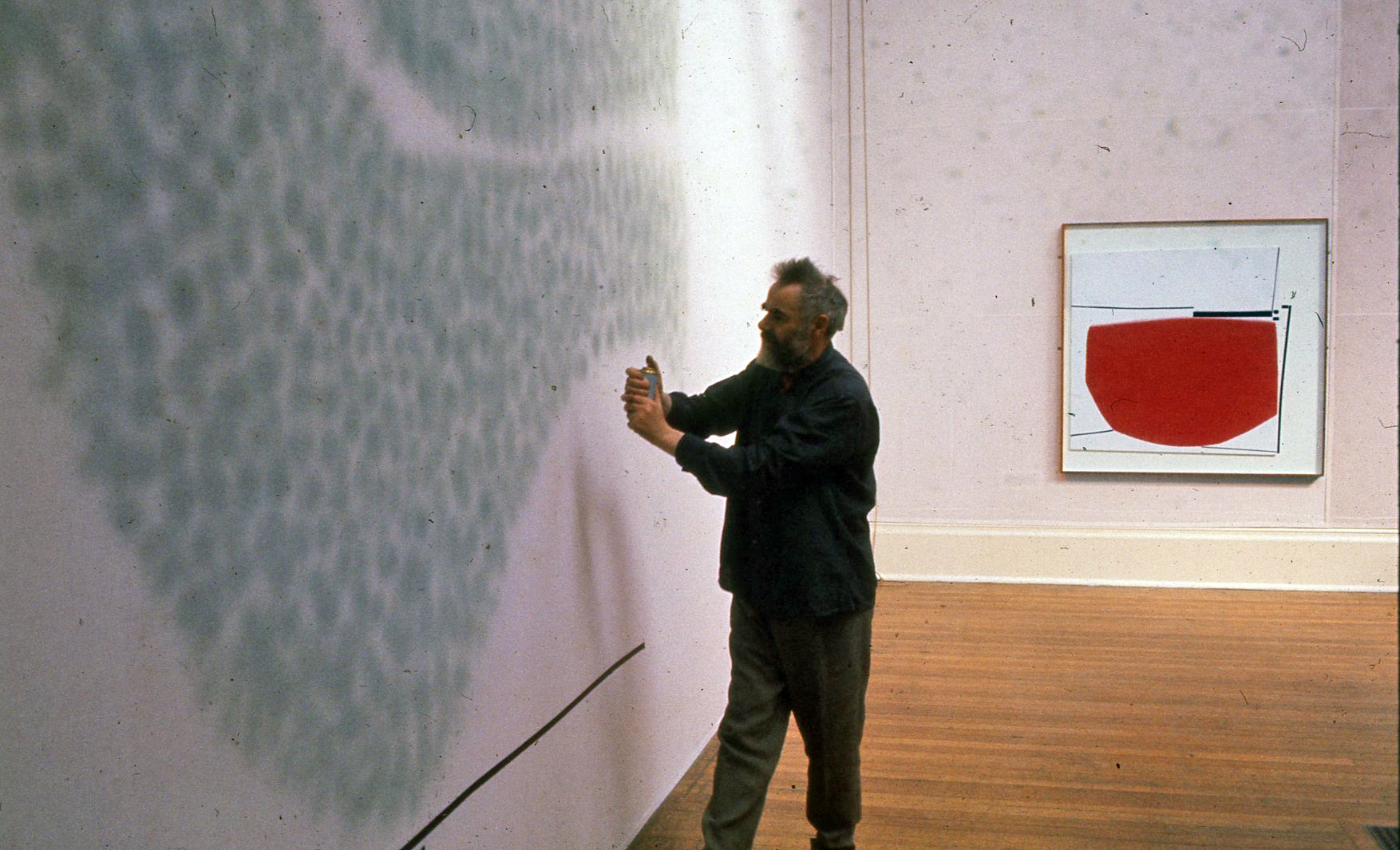Victor Pasmore painting the mural in situ at the Tate in 1965 ...